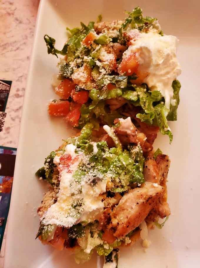 Chicken sopes topped with fresh ingredients and a generous dollop of sour cream, because balance is important.