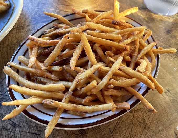 French fries piled high enough to share, though let's be honest, you probably won't want to do that.