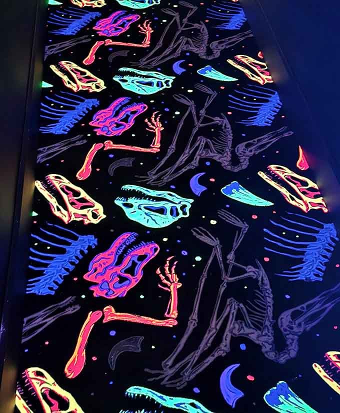 The floor becomes a canvas of glowing bones, turning every step into a prehistoric dance.