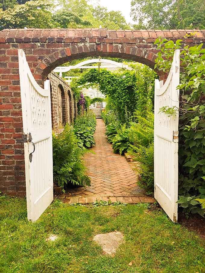 Step through this brick archway into a secret garden that feels like discovering Narnia, minus the talking lions.