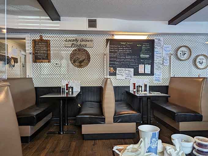 Booth seating with a farmhouse vibe and locally grown produce sign, because comfort matters as much as cuisine.