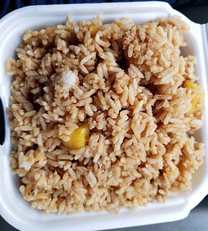 Pineapple fried rice brings tropical sweetness to every savory bite, like vacation in a takeout container.
