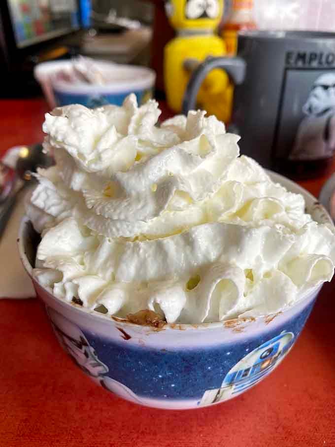 Bread pudding topped with a mountain of whipped cream is how you end a meal in style.