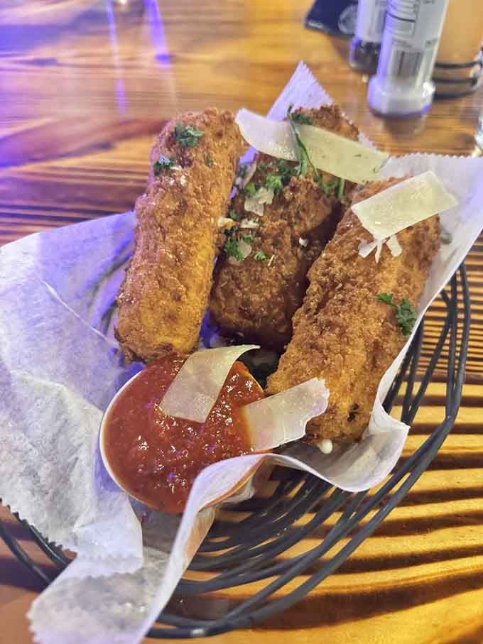 Golden cheese sticks with a side of marinara: the appetizer that never goes out of style, no matter what decade.