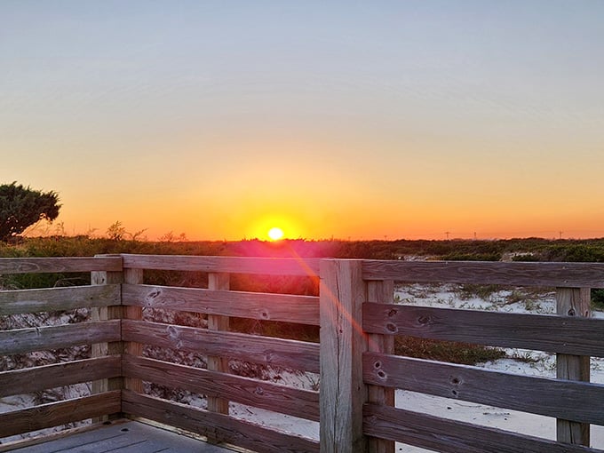 Golden hour at the beach access point proves that free entertainment still exists in this world.