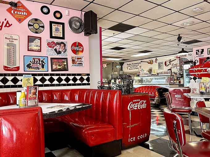 Every booth offers a front-row seat to mid-century magic, complete with Coca-Cola coolers and retro charm.