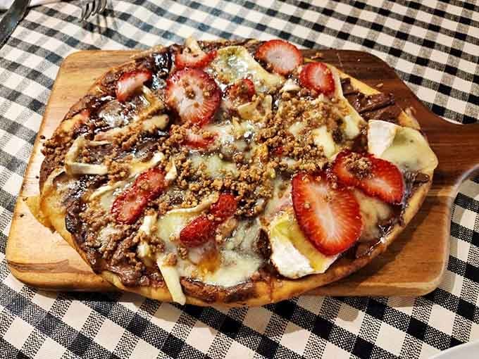 Nutella and strawberries on flatbread is what happens when dessert pizza grows up and gets really, really good at life.