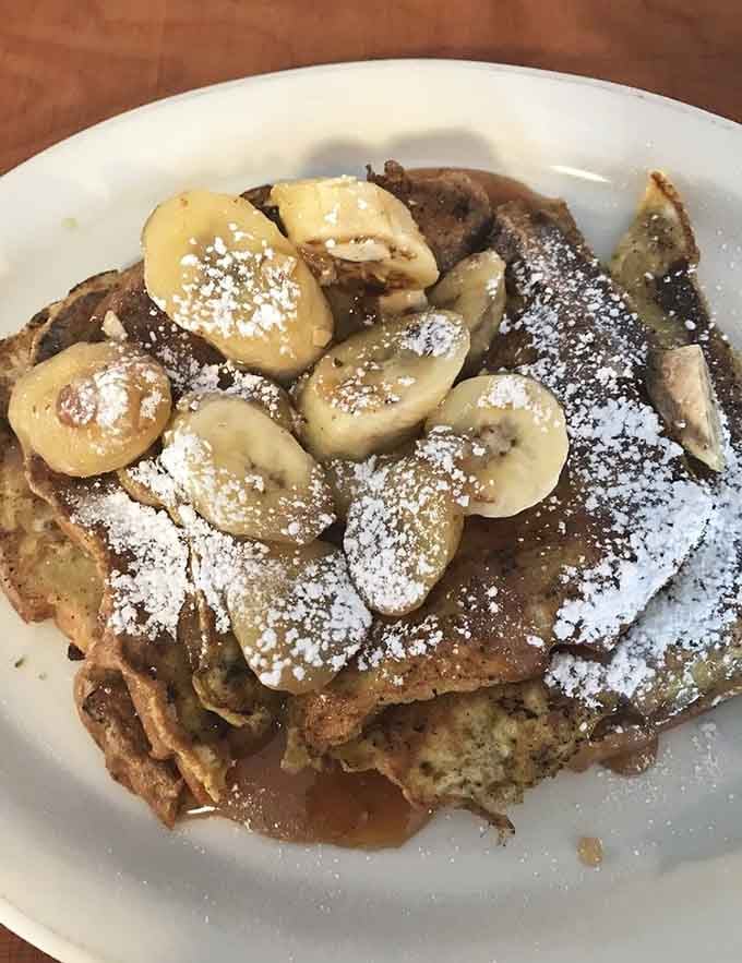 Sliced bananas on French toast bring sweetness to balance the savory, creating the kind of harmony Jerry and George never achieved.