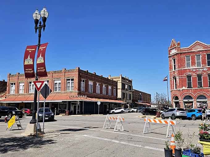 Banners wave proudly over streets where the most important business has always been perfecting the art of smoked meat.