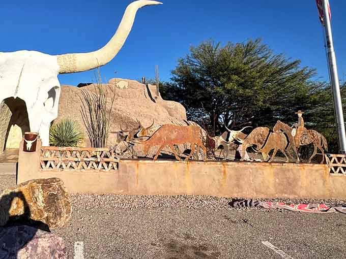 Metal longhorn sculptures flank the entrance, because apparently one giant cow skull simply wasn't enough commitment to theme.