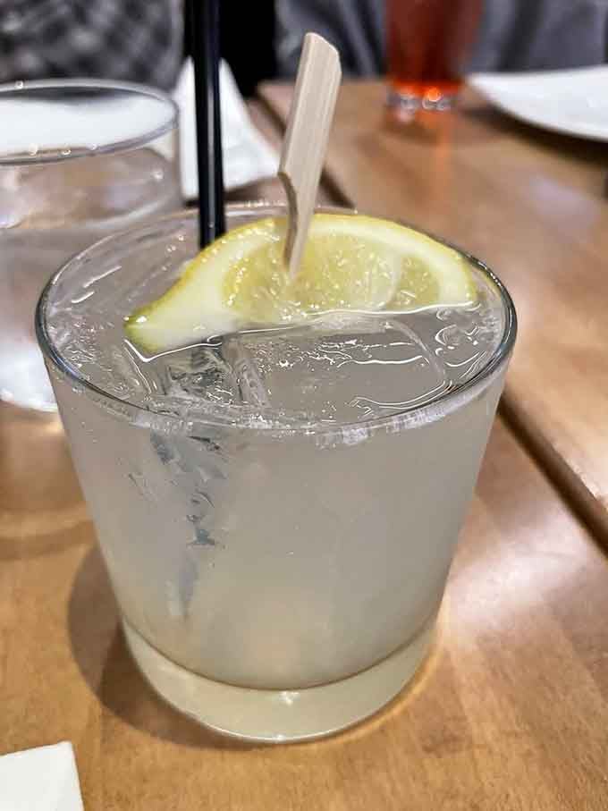A citrus-forward cocktail that looks as refreshing as it tastes, perfect for sipping while contemplating your next menu order carefully.