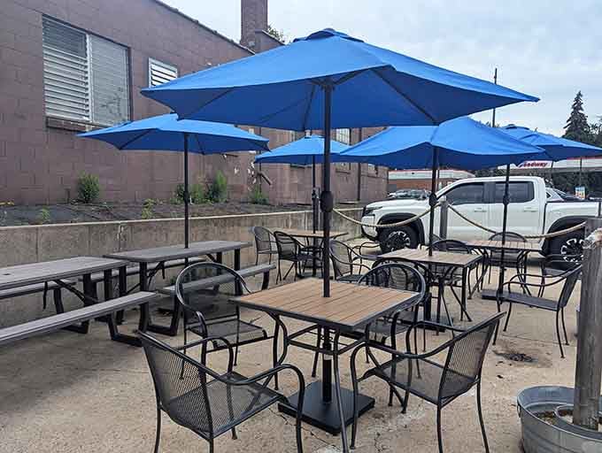 Blue umbrellas and fresh air make the perfect setting for enjoying your seafood feast on a beautiful day.