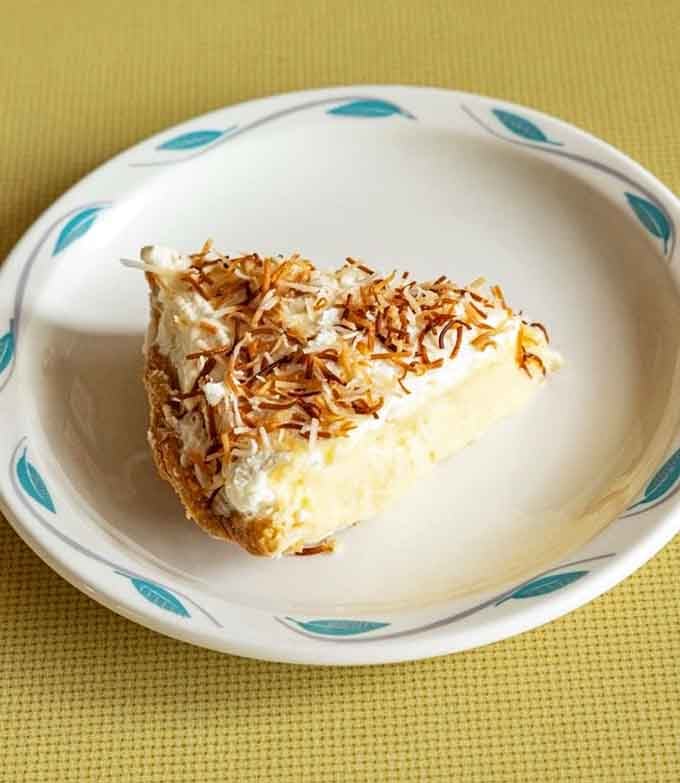 Coconut cream pie with toasted coconut on top, the sweet ending your seafood feast absolutely deserves today.