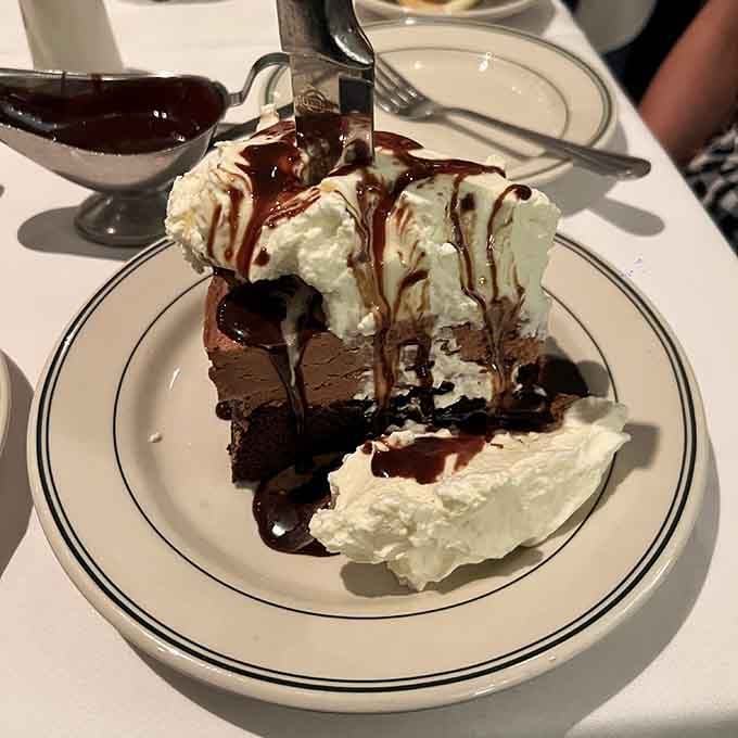 That chocolate brownie sundae is what happens when a steakhouse decides dessert should be as impressive as dinner.