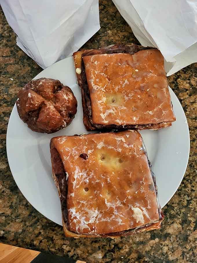 Apple squares and a twisted cruller proving that Marie's doesn't play favorites&mdash;everything here gets the royal treatment.