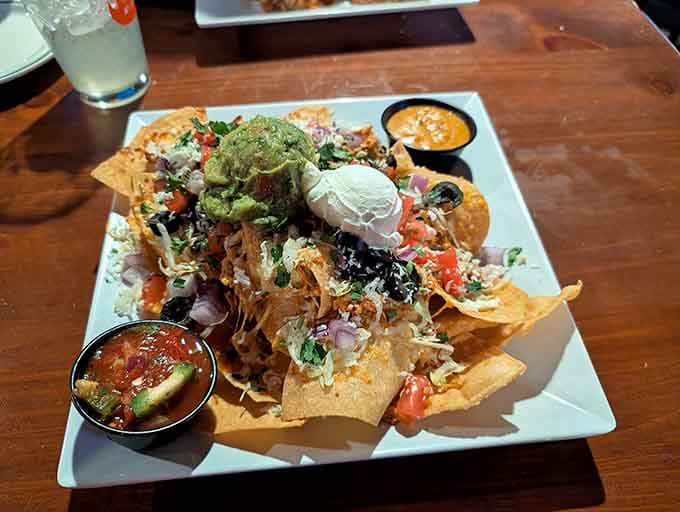 This nacho mountain could feed a small village, piled high with everything good and right in the world.