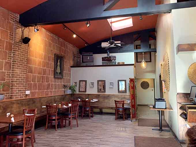 Exposed brick and thoughtful lighting make this space feel both contemporary and timeless, downtown Asheville dining at its finest.