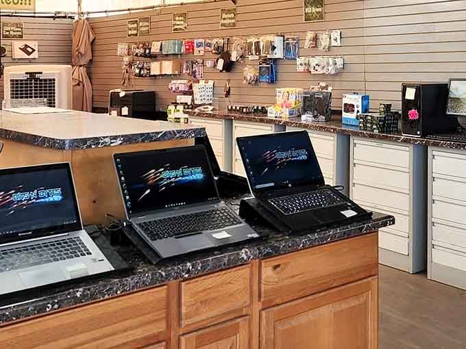 Laptops and electronics at swap meet prices, proving technology doesn't always require a second mortgage to afford.
