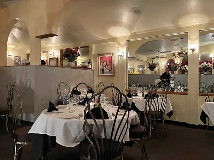White tablecloths and warm lighting create the kind of ambiance that makes every dinner feel like a celebration.