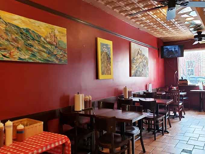 Red walls and framed photos create an atmosphere that's part neighborhood hangout, part barbecue temple of deliciousness.