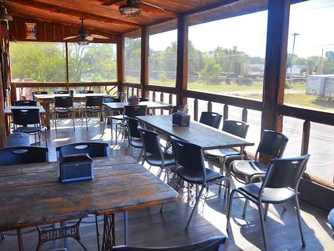The patio offers fresh air and scenic views, perfect for contemplating your next round of smoked meat decisions.