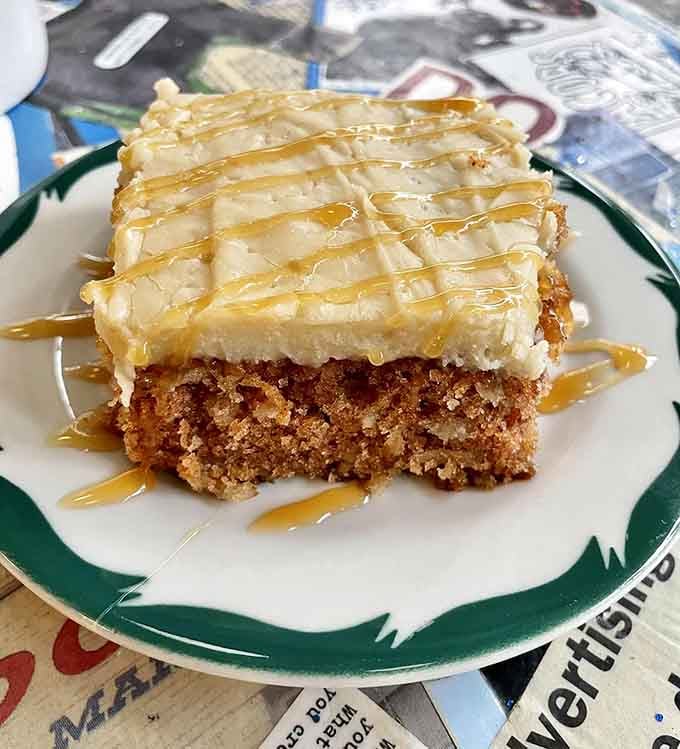 Caramel drizzle cascading over cream cheese frosting proves that dessert for breakfast is perfectly acceptable behavior.