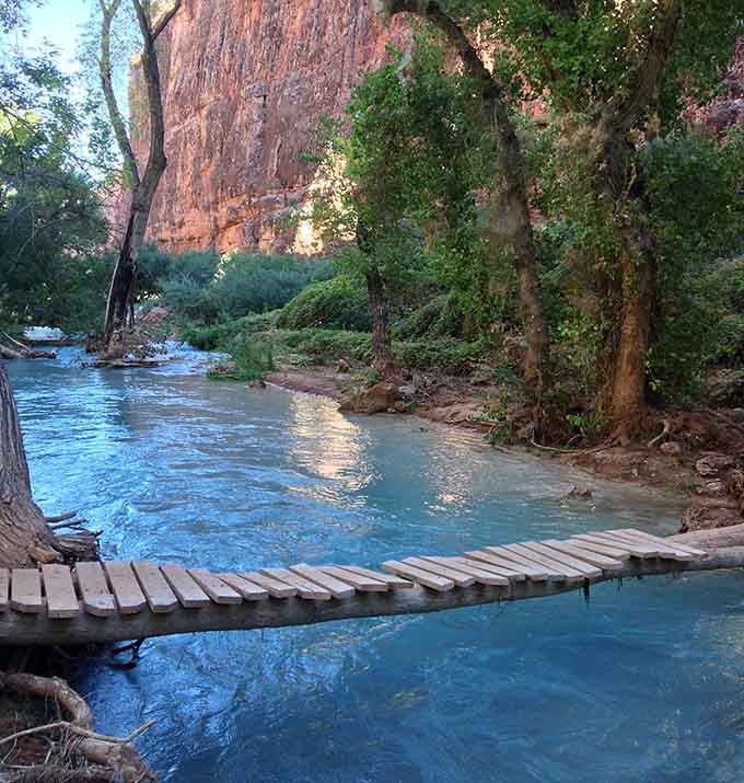 This footbridge over turquoise water is basically the scenic route to your happy place.