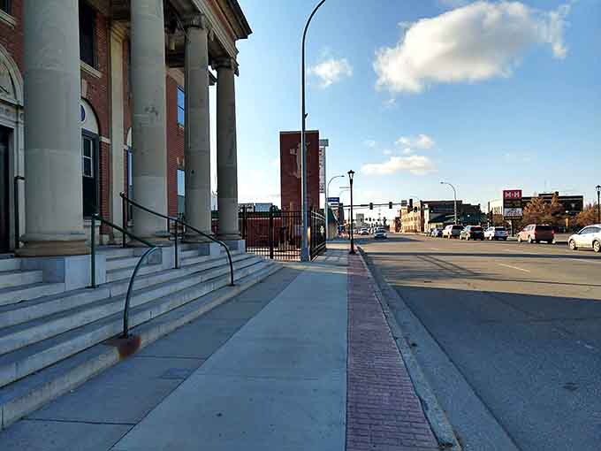 Classic columns frame downtown streets where history and daily life intersect without requiring a museum admission fee.