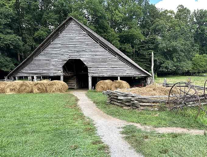 Hay bales rest in the barn like they're waiting for their close-up in a country music video.