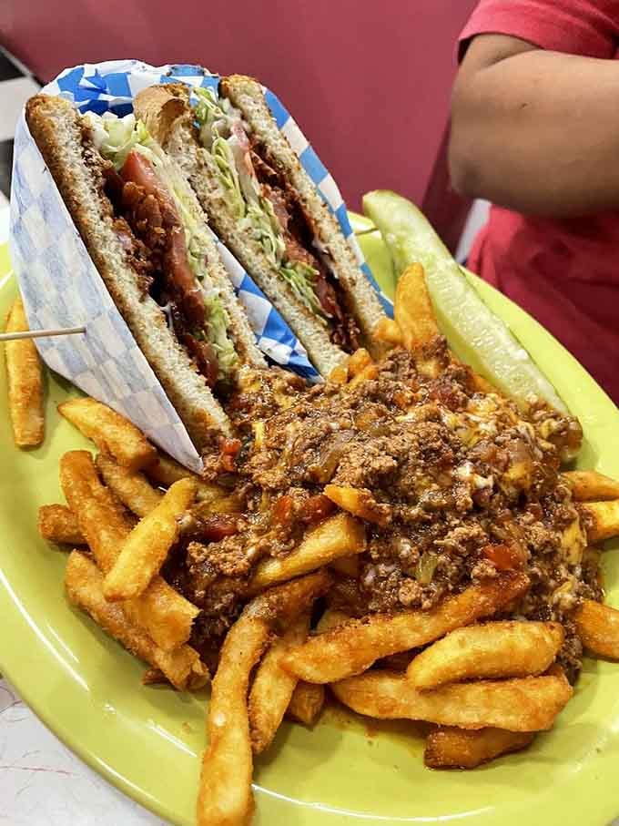 That BLT looks innocent enough, but those chili cheese fries are plotting something deliciously dangerous beside it.