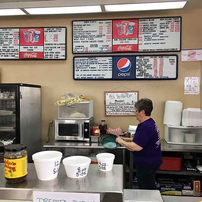Behind that counter, magic happens daily as authentic Cajun cuisine emerges from the most unexpected kitchen around.