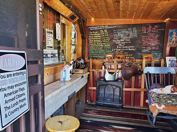 The order window and chalkboard menu beckon from this angle, while the wood stove promises warmth on foggy days.
