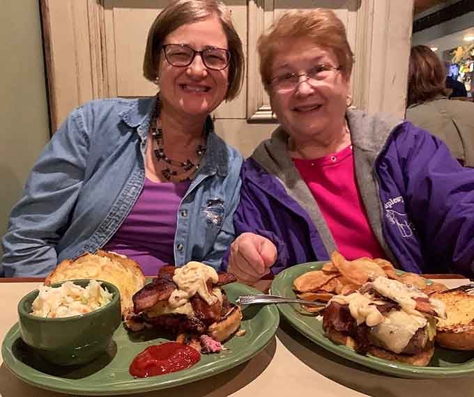 The smiles say it all, this is where good food brings people together for moments that become cherished memories.