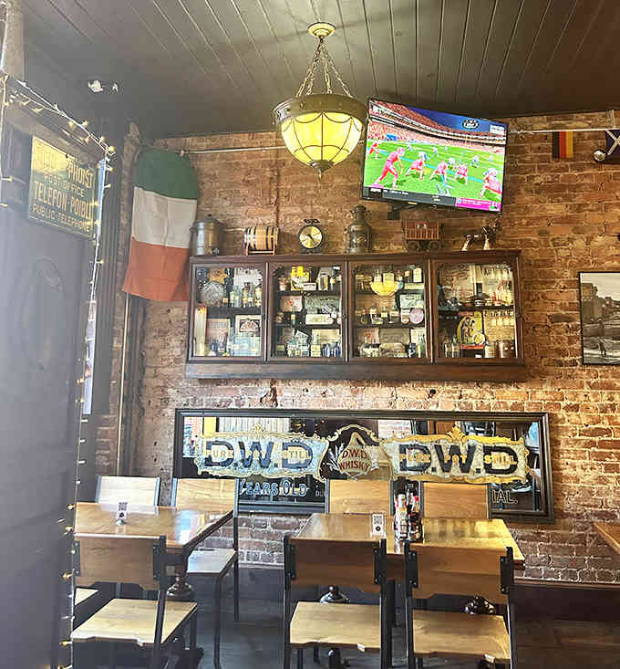 The Irish flag hanging proudly alongside exposed brick and vintage fixtures creates authentic Celtic charm without trying.