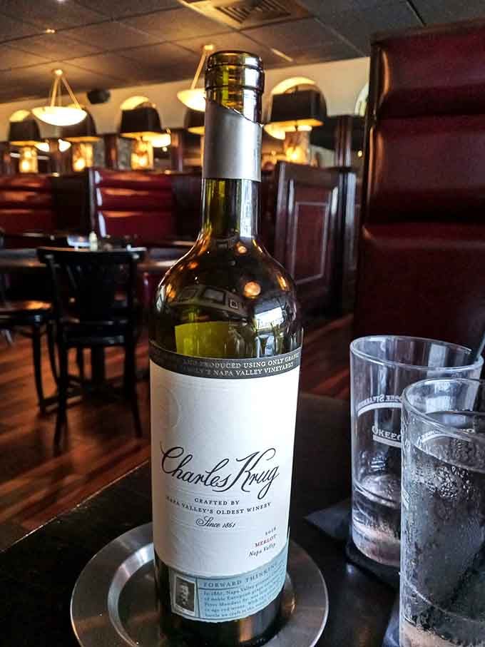 A quality bottle of wine in a classic steakhouse setting, proof that some traditions never need updating or improvement.