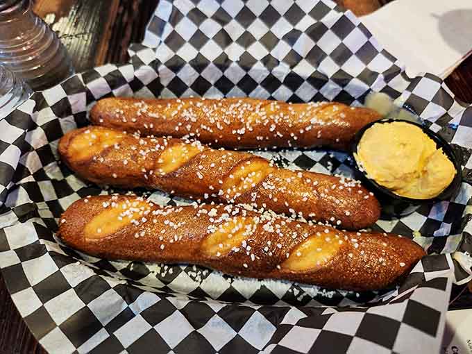 Pretzel sticks dusted with salt like they're dressed for a fancy occasion, which eating them definitely is.
