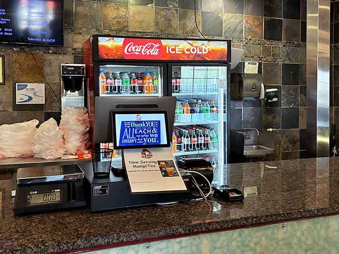 The beverage station stands ready to quench your thirst after sampling everything this buffet has to offer today.