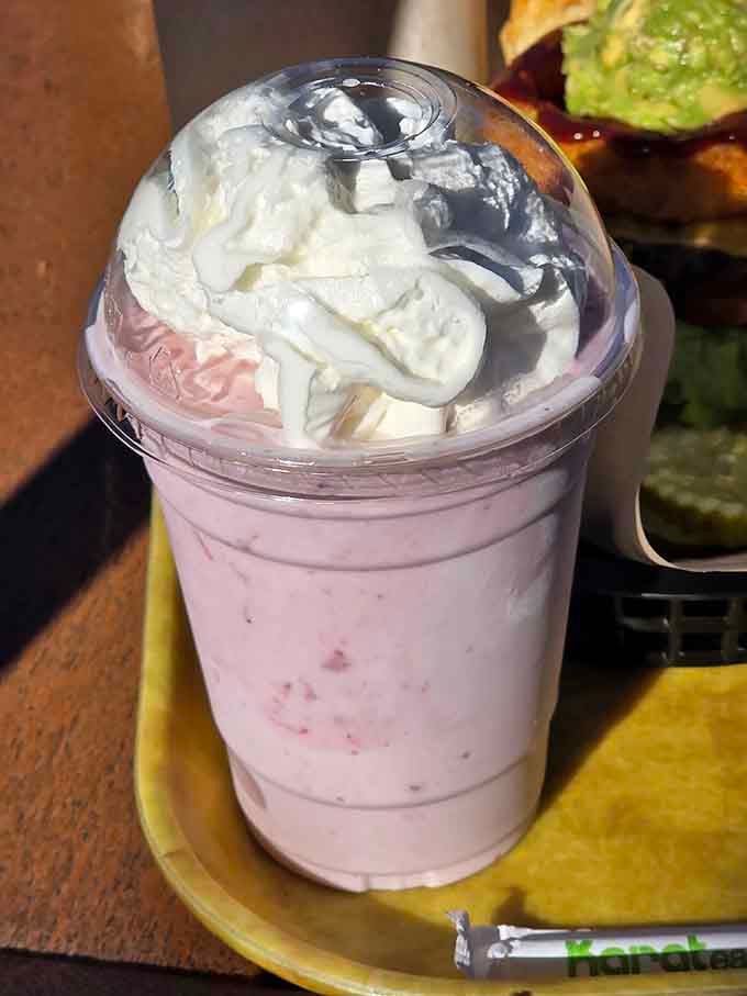 Strawberry shake topped with whipped cream because sometimes you need to treat yourself right, friend.