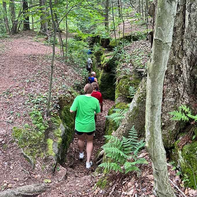 Fellow adventurers navigate the stone maze, proving this geological wonderland appeals to explorers of absolutely every age and ability.