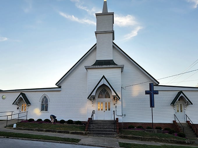 White clapboard churches like this one anchor communities, standing graceful and timeless against the Indiana sky.