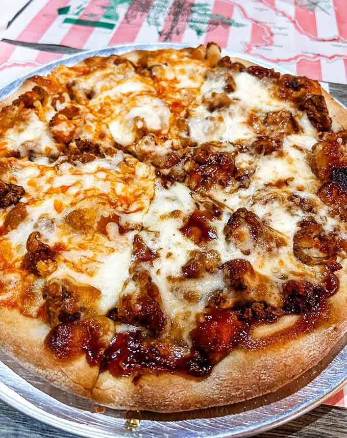 This pizza wears its toppings like a badge of honor, with cheese bubbling across every glorious inch.