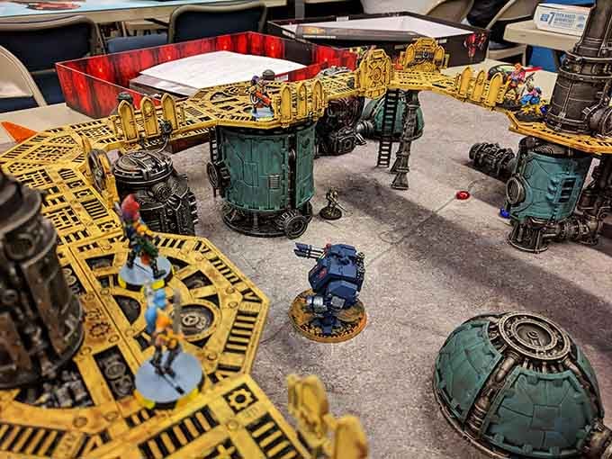 This elaborate tabletop battlefield setup shows the serious dedication gamers bring to their craft and creative storytelling sessions.