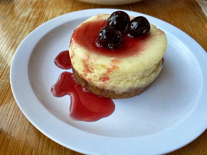 Cheesecake topped with cherries and berry sauce, the perfect sweet ending to your carbohydrate-filled adventure.