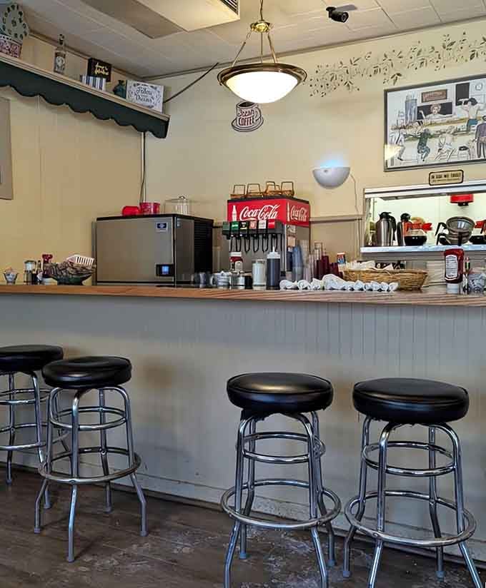 Classic diner counter with swivel stools where you can watch breakfast magic happen right before your hungry eyes.