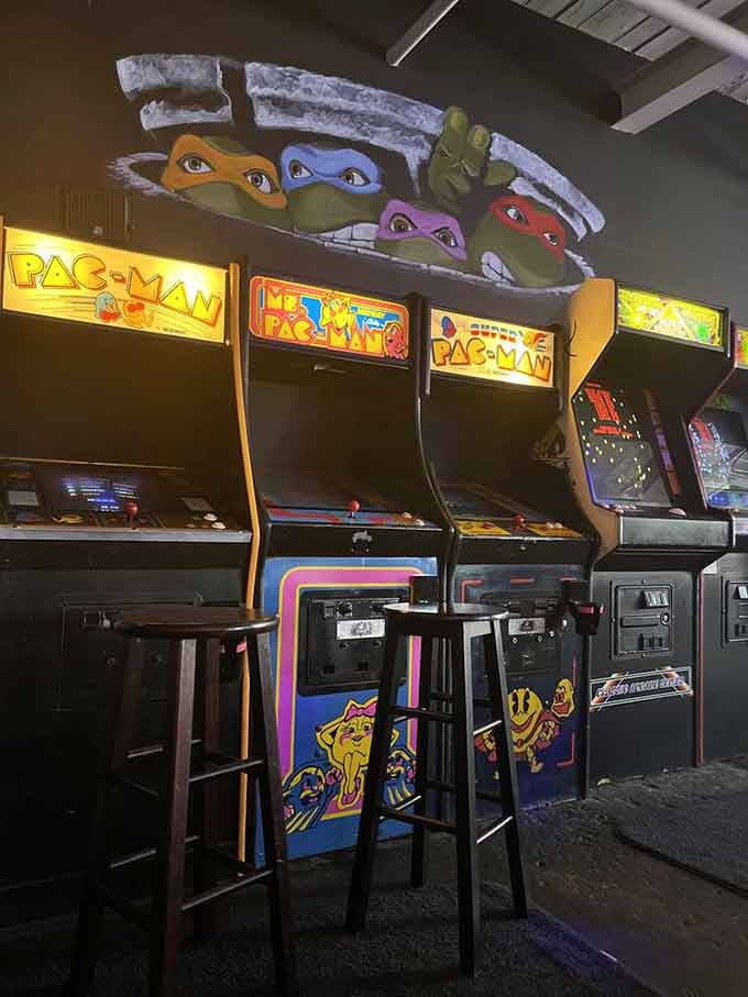 Pac-Man cabinets standing tall with the Teenage Mutant Ninja Turtles watching over, a perfect mashup of eighties excellence.
