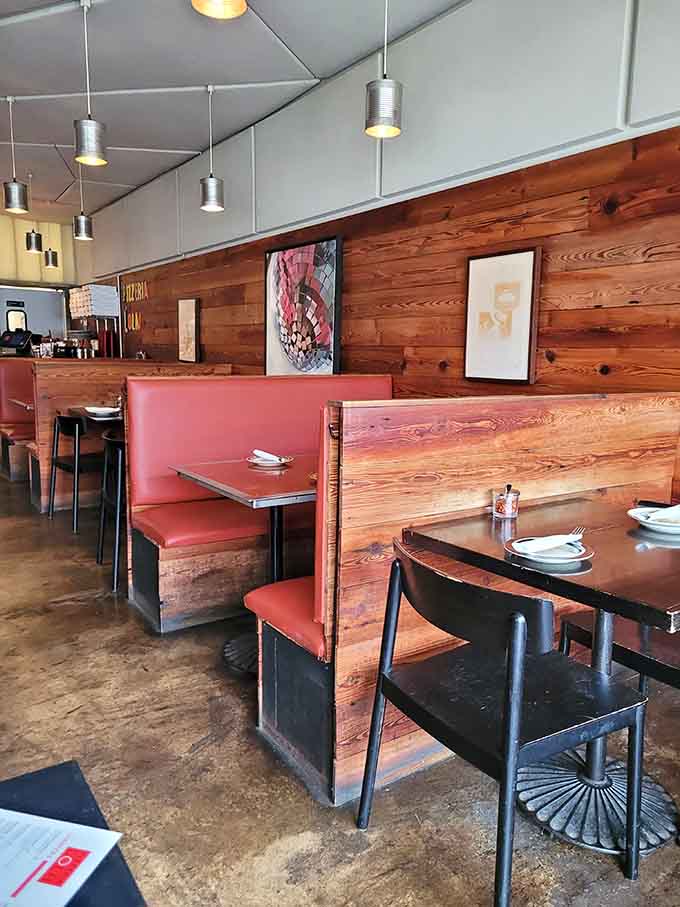Red booths and warm wood create the kind of comfortable atmosphere where time slows down nicely.