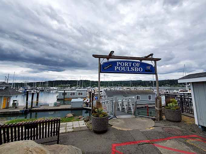 Two carved eagles perch above the marina entrance, welcoming boaters to Liberty Bay's protected waters and scenic moorage.