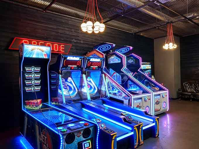 Vintage arcade games glow with neon promise, ready to accept your quarters and your dignity equally.