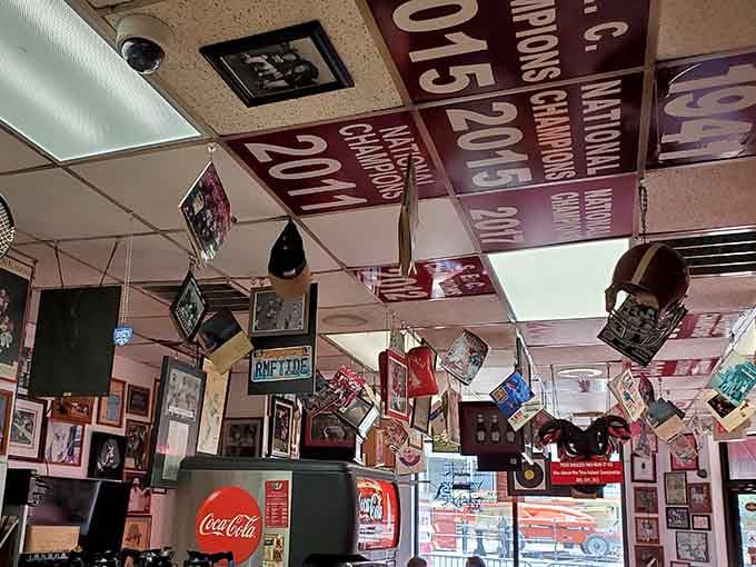 The ceiling decorations include championship banners because apparently the walls ran out of room for all this accumulated football excellence.
