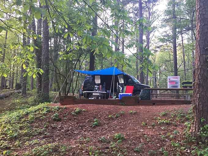 Tent camping with lake views proves you don't need a mortgage to wake up in paradise.